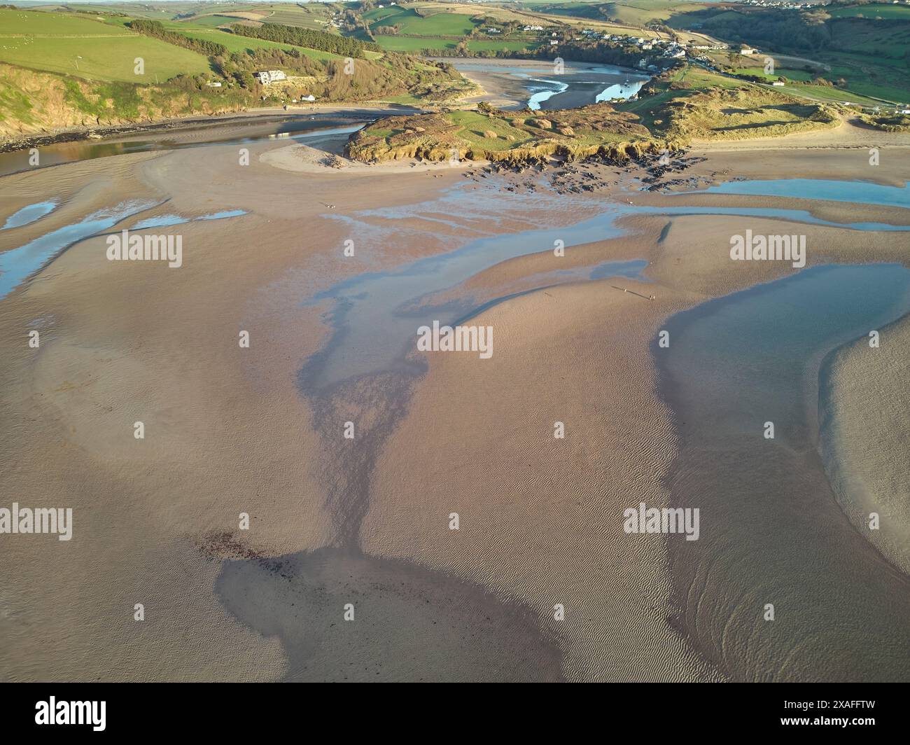 An aerial view over sandbanks in the mouth of the River Avon, seen at ...