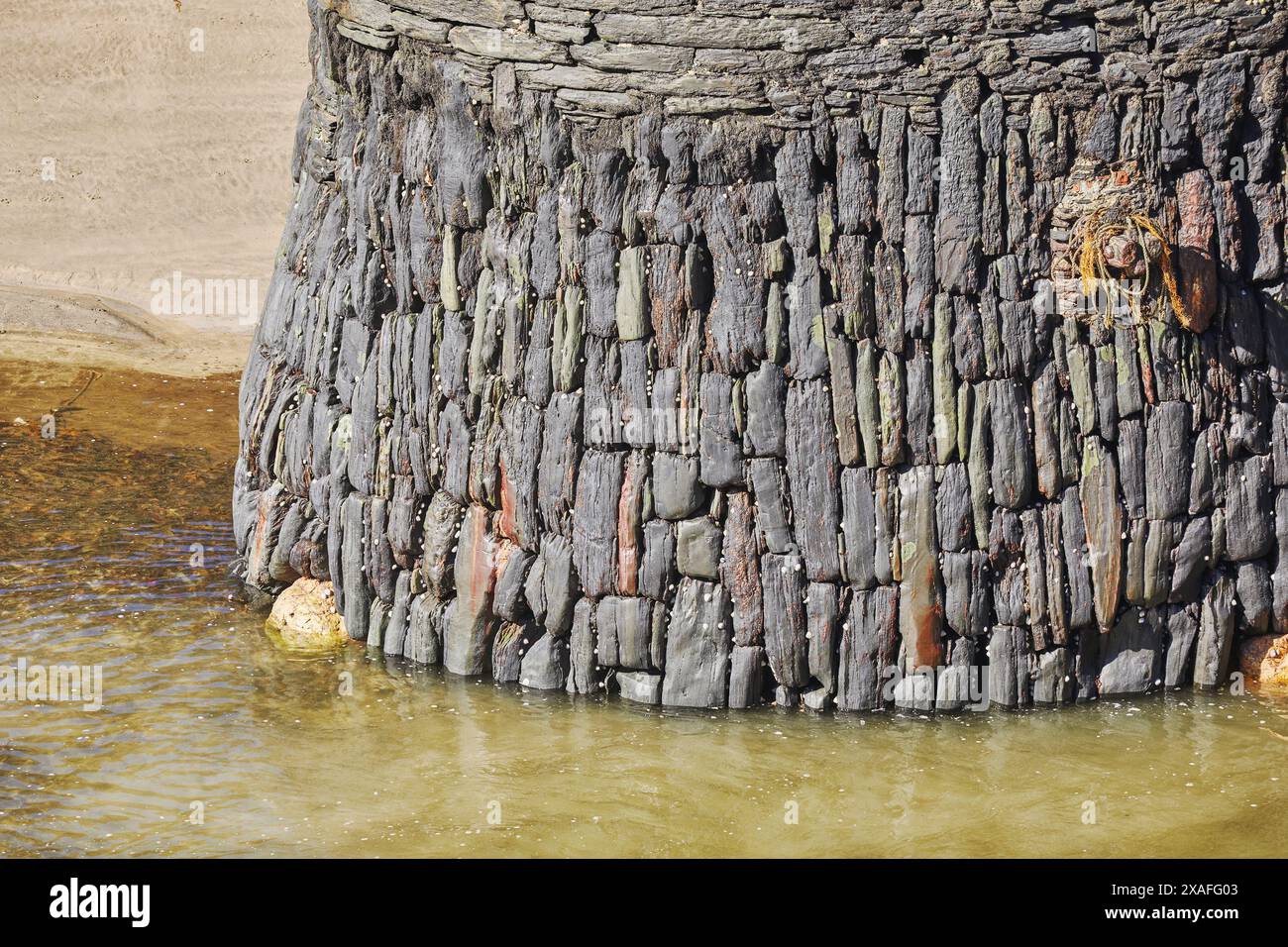 Detail of an old wall; the harbour wall in Boscastle harbour, on the ...
