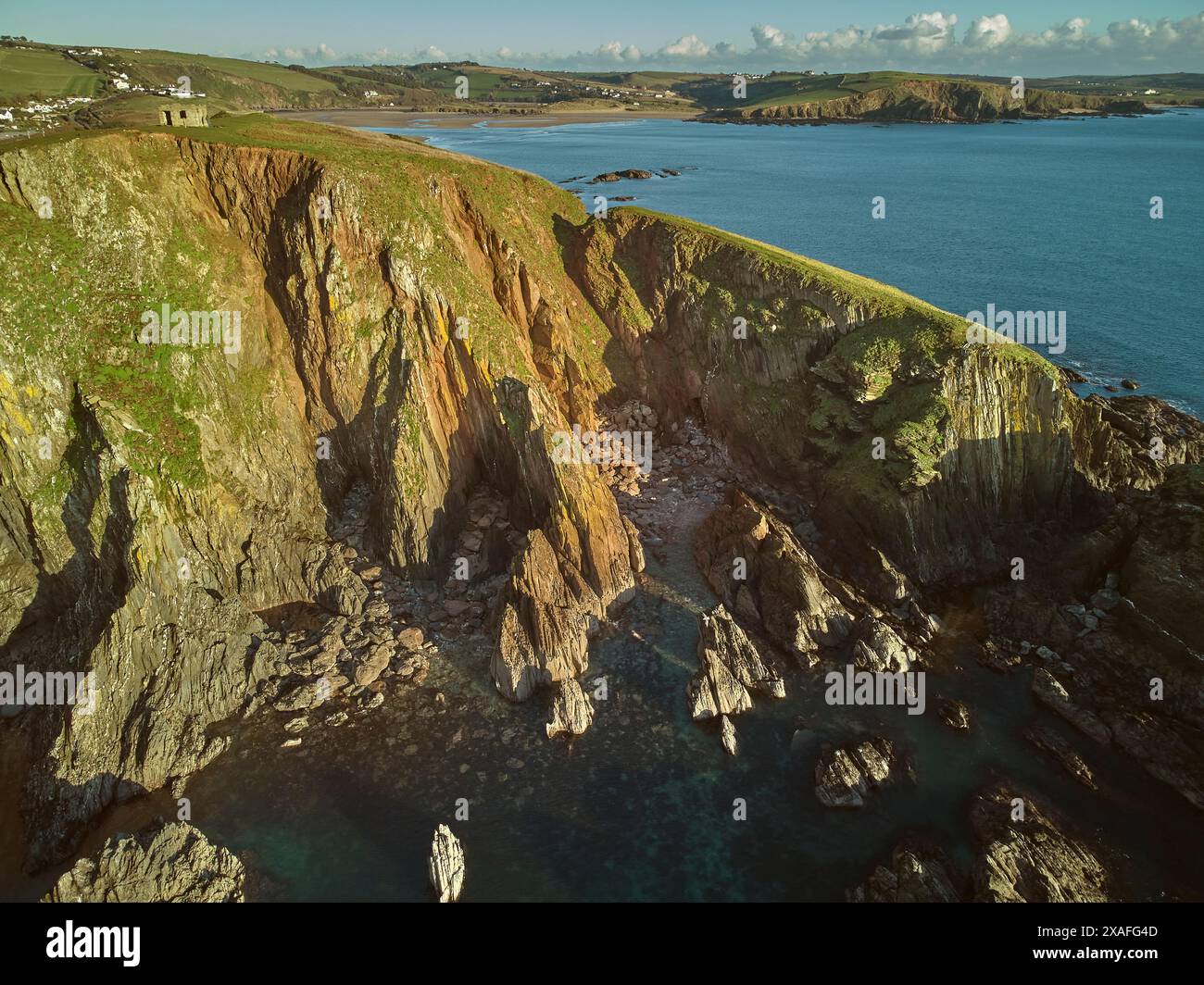 An aerial view of rugged cliffs on the south side of Burgh Island ...