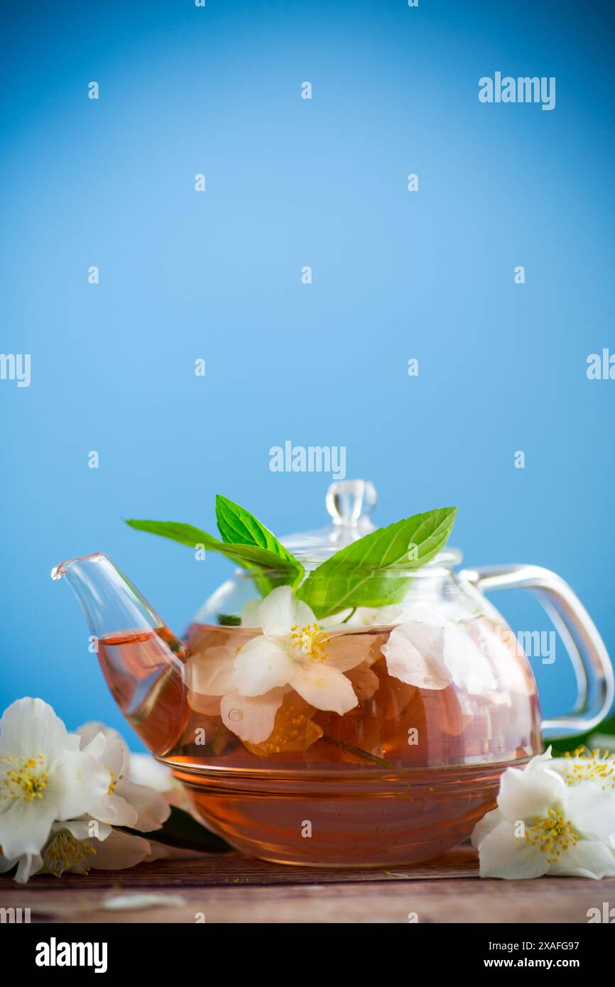 jasmine flower tea in a glass teapot Stock Photo - Alamy