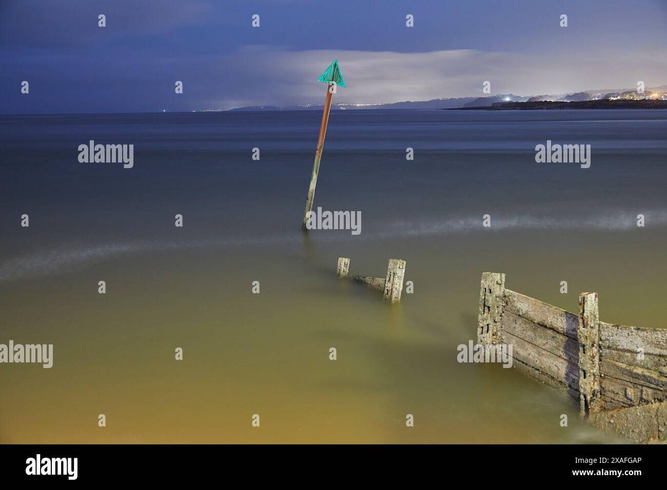 A night time view of seashore defences, protecting the shore from ...