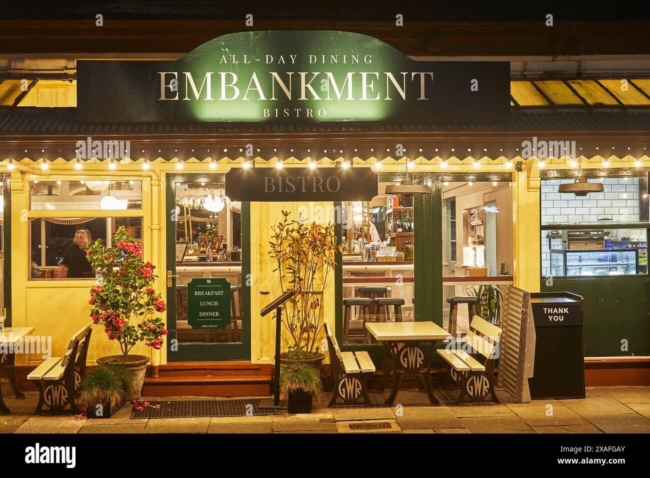 A harbourside restaurant at night, in Dartmouth, Devon, Great Britain ...