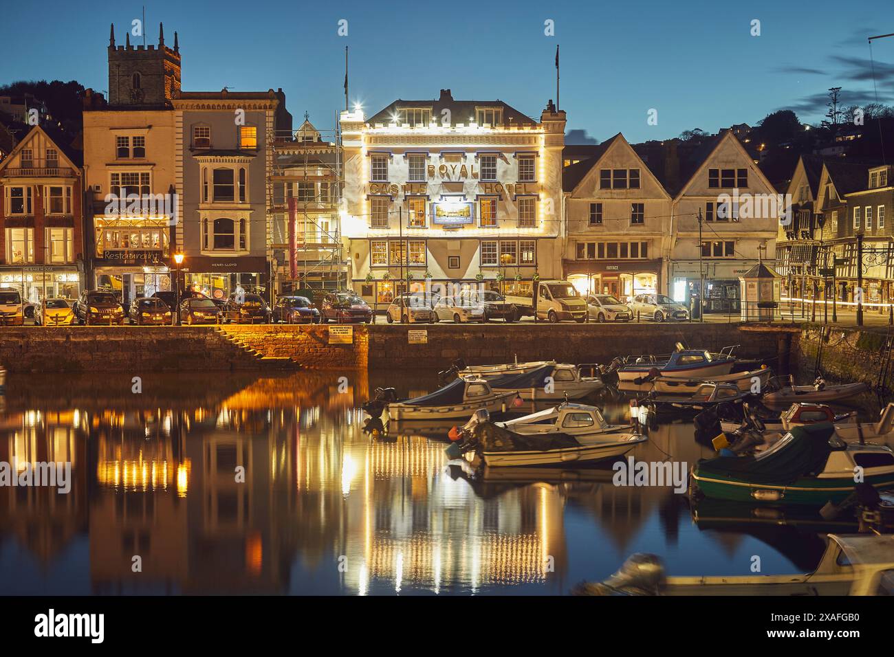 A dusk view of the old harbour, at Dartmouth, Devon, Great Britain ...