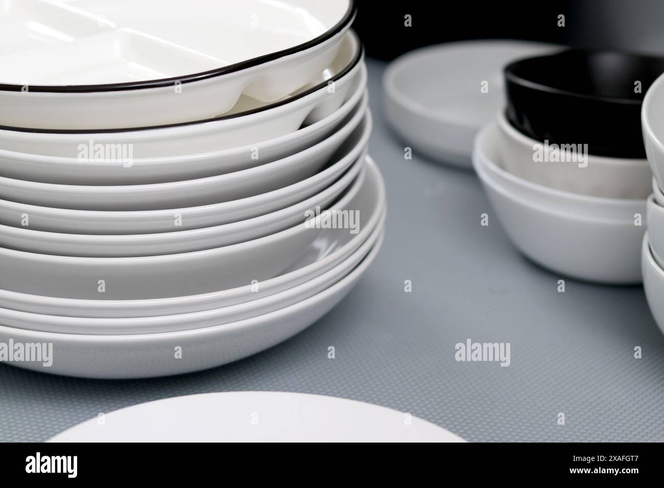 Close up of white plates and other dishes in a kitchen cabinet Stock ...