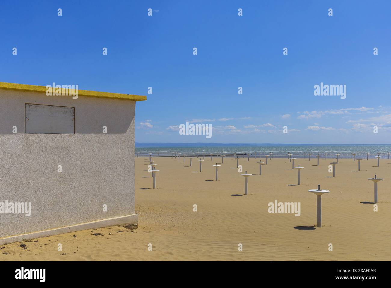 Panoramic photo of Adriatic sea beach in city of Grado with tiny white ...