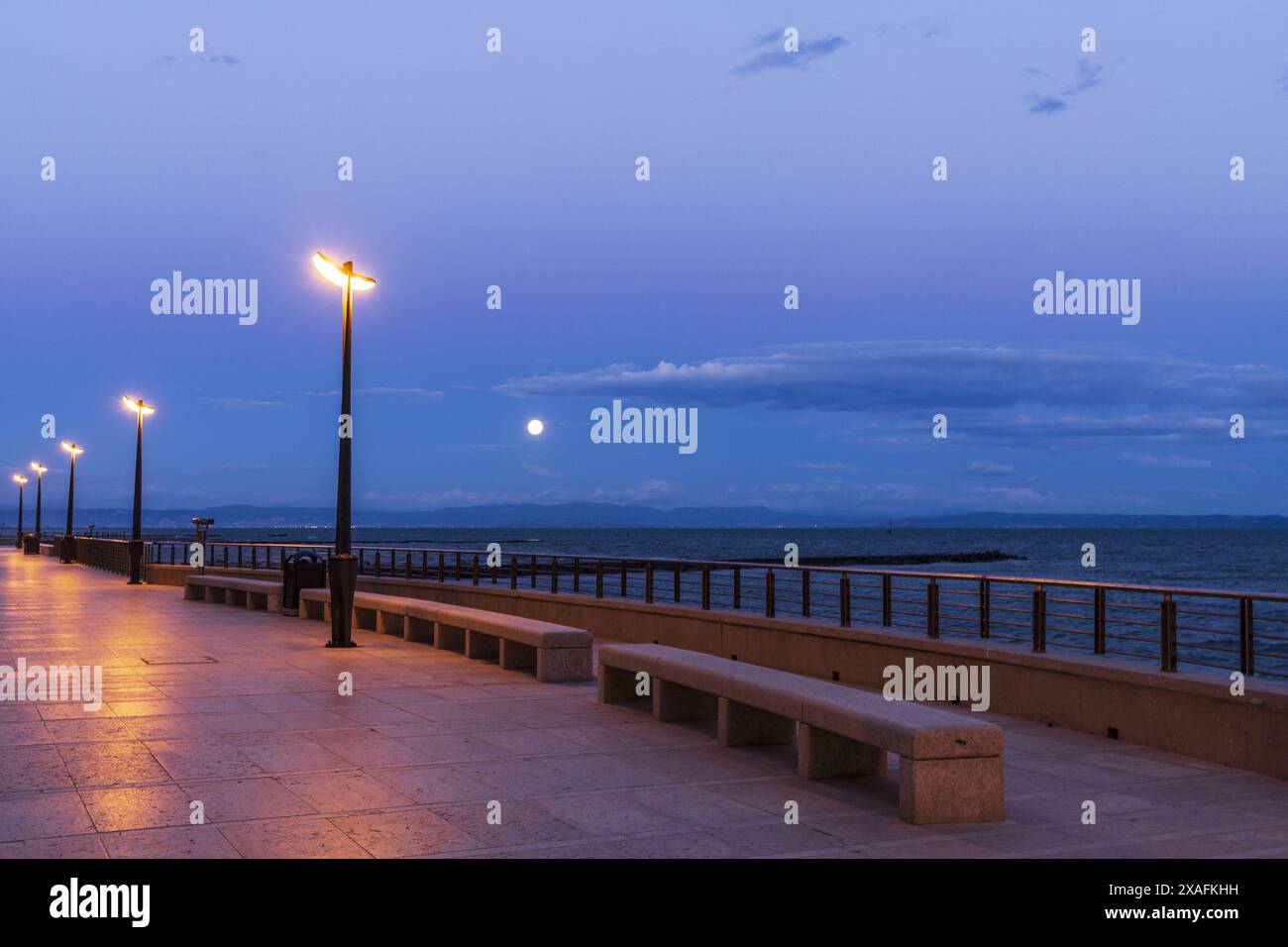 photo of moonrise from a seafront along Adriatic sea in city of Grado ...
