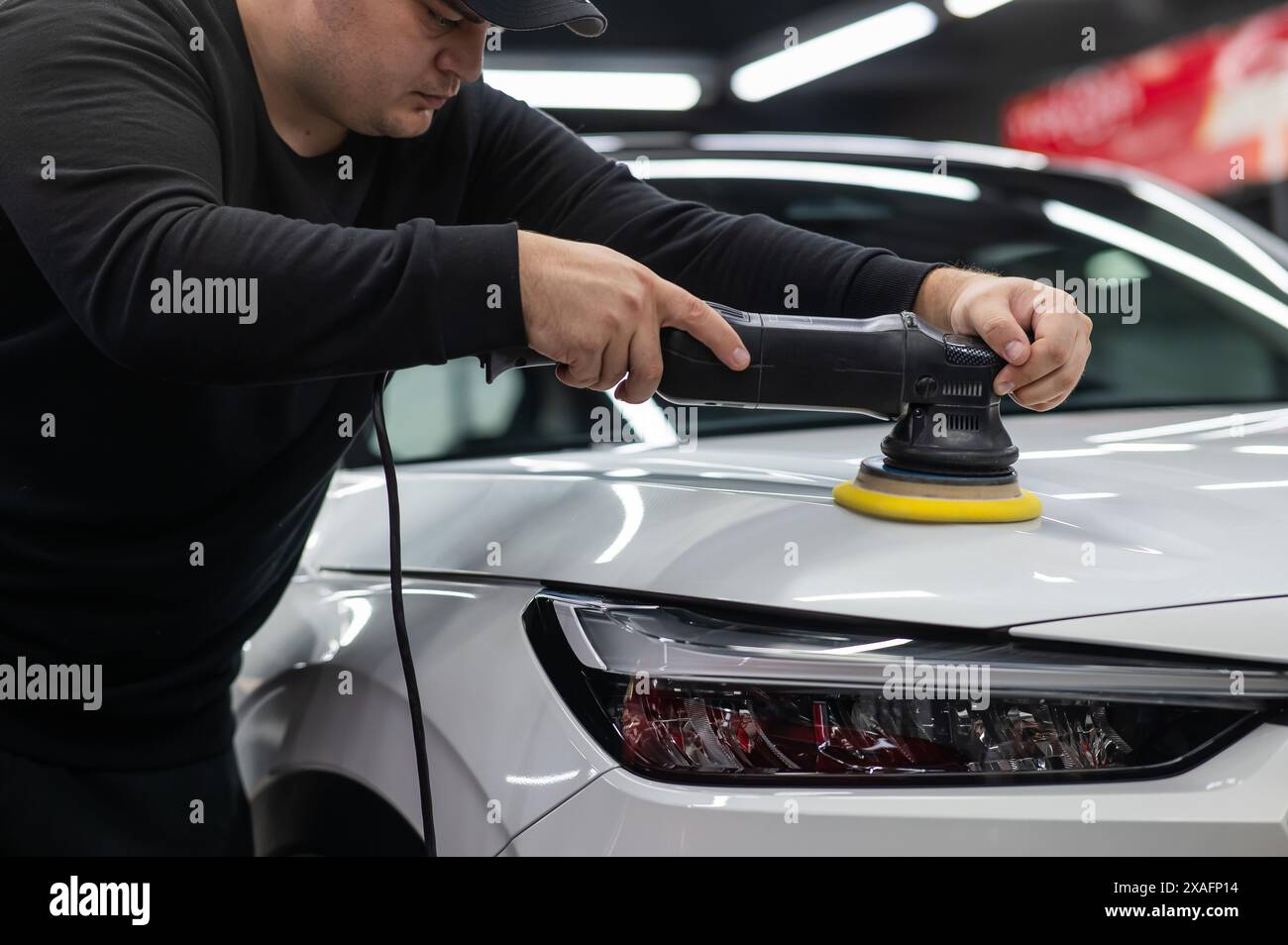 Process of polishing white car hood surface using orbital polishing ...
