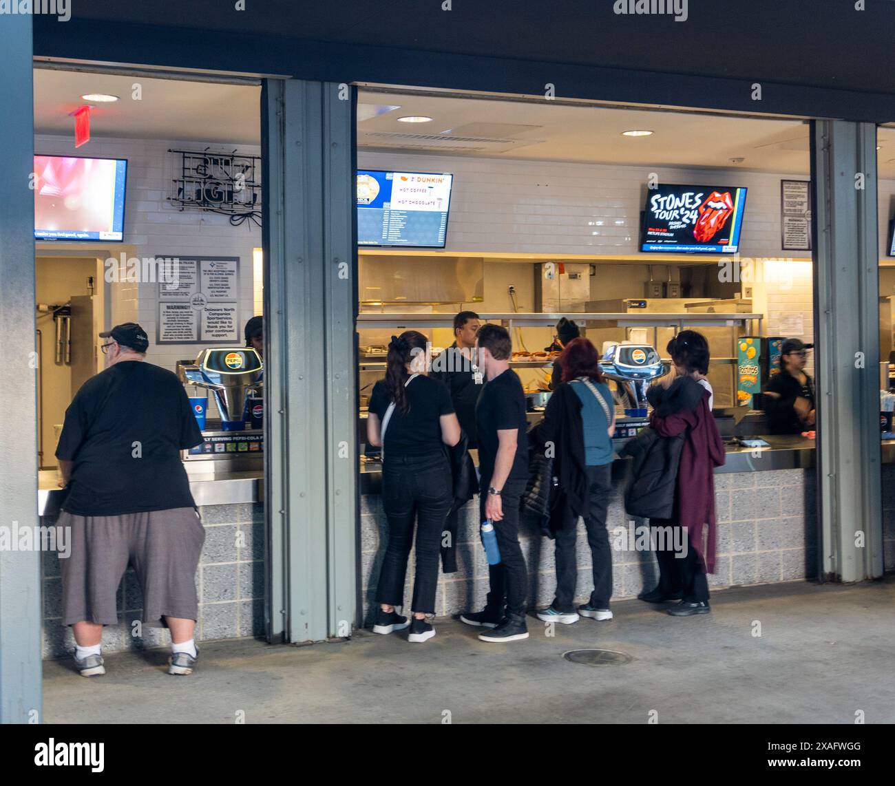 People at a concession stand at MetLife Stadium before a Rolling Stones ...