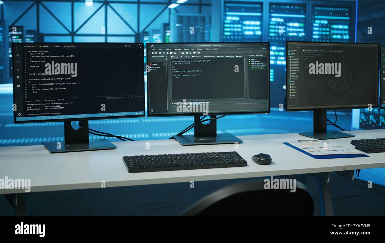 Lines of code running on computer screens in data center, used for troubleshooting rackmounts in ...