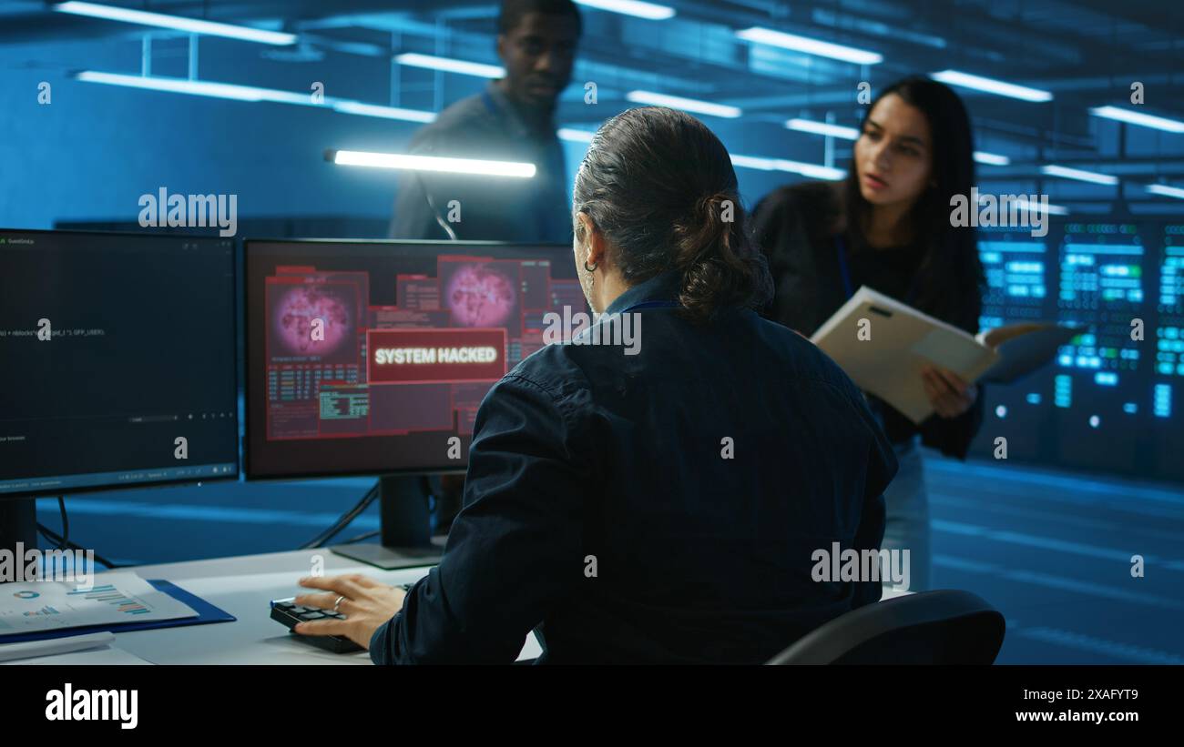 Admin in server hub panicked by valuable data threatened by hacking attack on computers. Scared ...