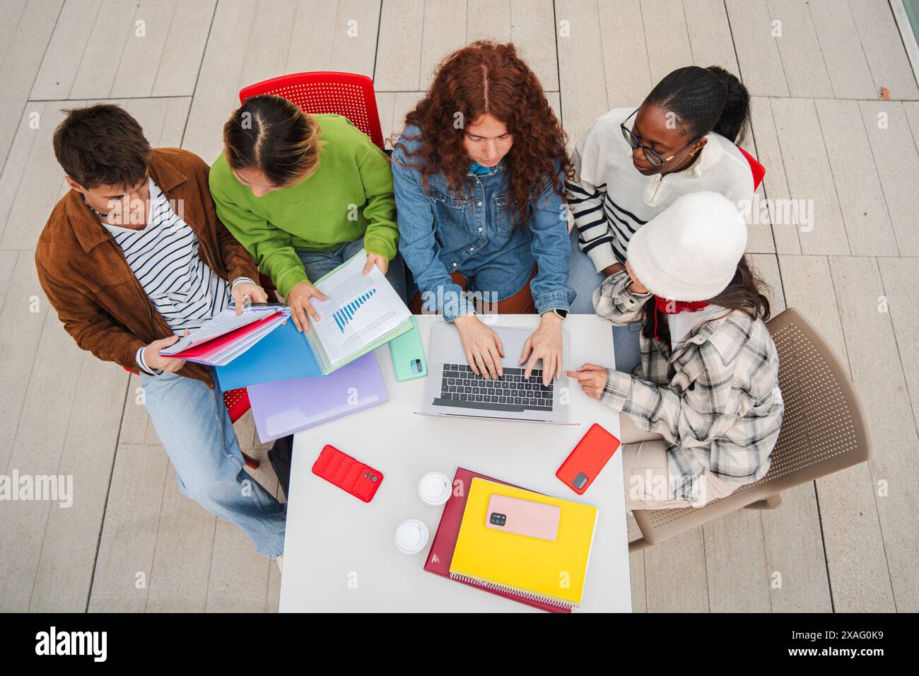 High angle view of a group of multiracial students doing the highschool ...