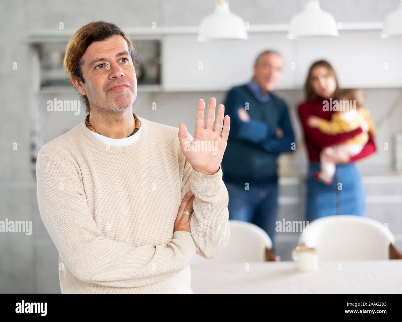Man and girl quarrel with older man Stock Photo - Alamy