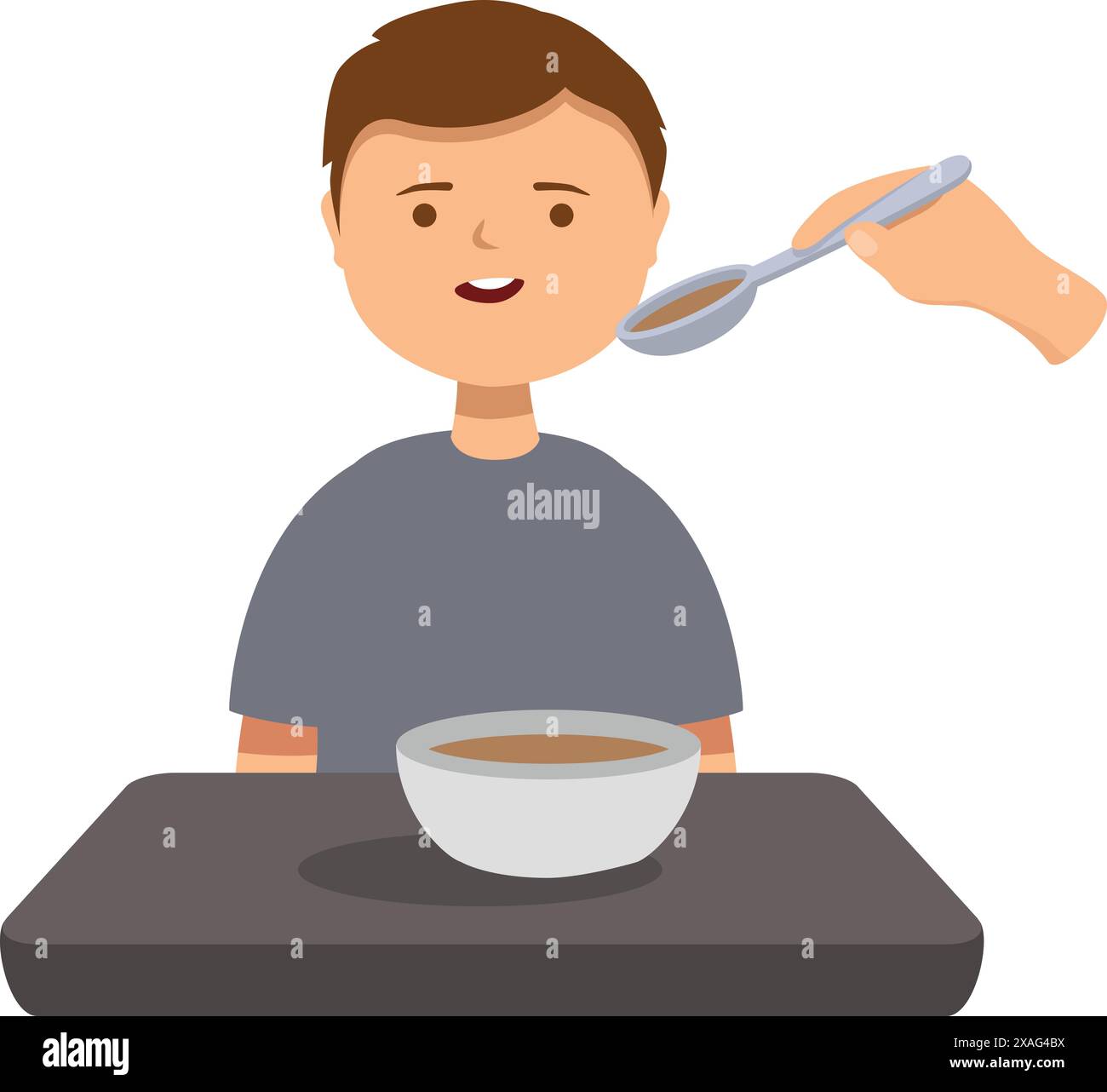 Boy eating with soup spoon Cut Out Stock Images & Pictures - Alamy