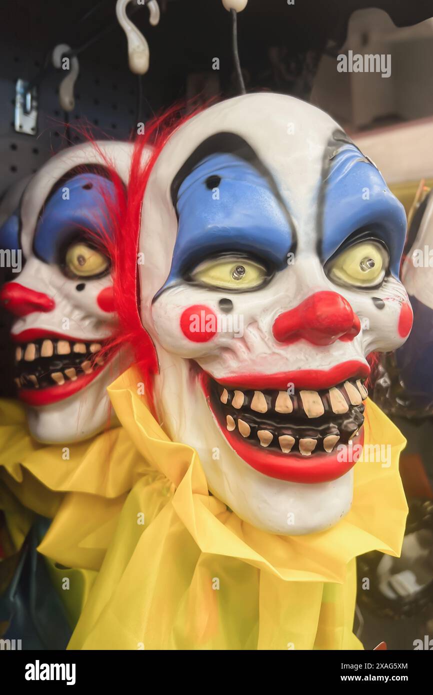 A scary clown in a shop Halloween Costume Store Stock Photo - Alamy