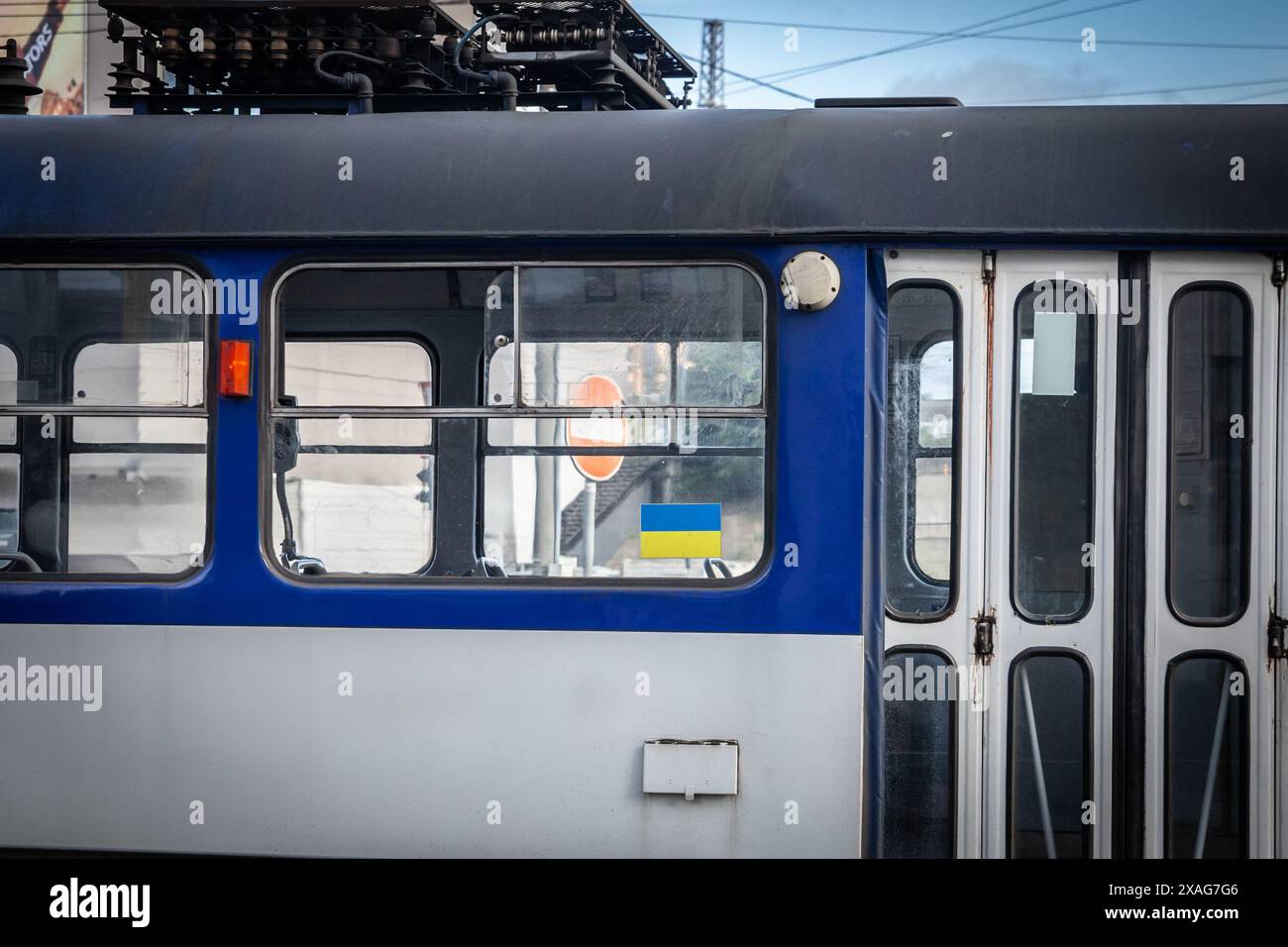 A Riga tram adorned with a Ukrainian flag symbolizes Latvia's support ...