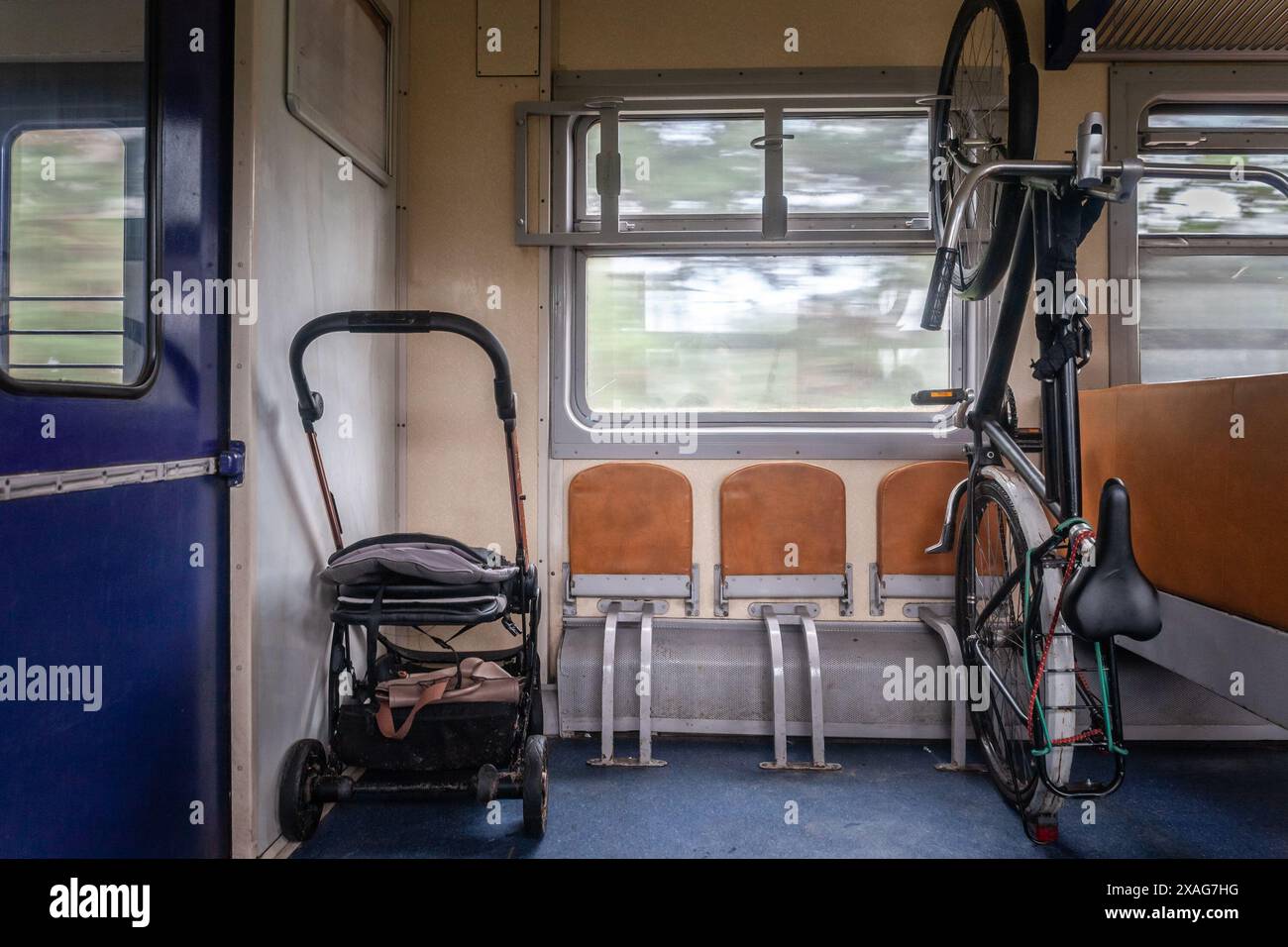 Picture of stroller and bicycle stored and parked together in a latvian ...