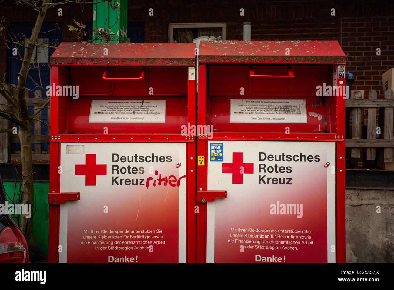 Picture of the logo of german rotes kreuz in front of a used clothes ...