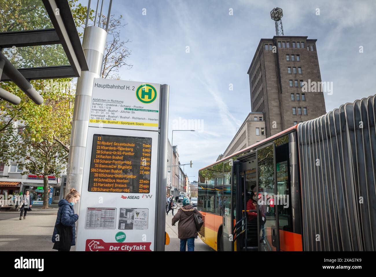 A bustling bus stop in Aachen, Germany, illustrating the city's ...