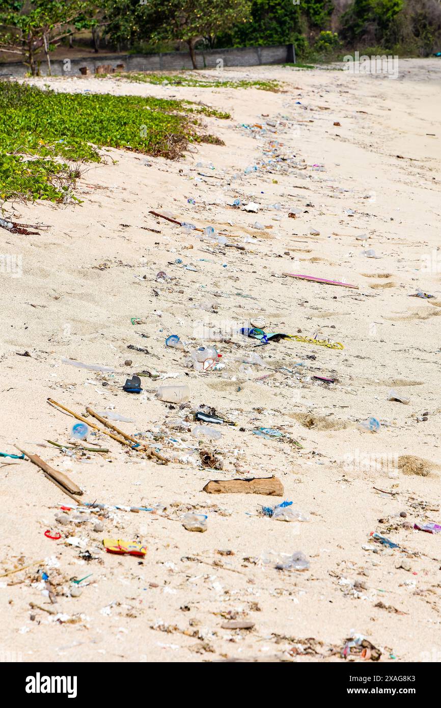 Plastic bags and other trash washed up on the beach of Tampah near Kuta ...