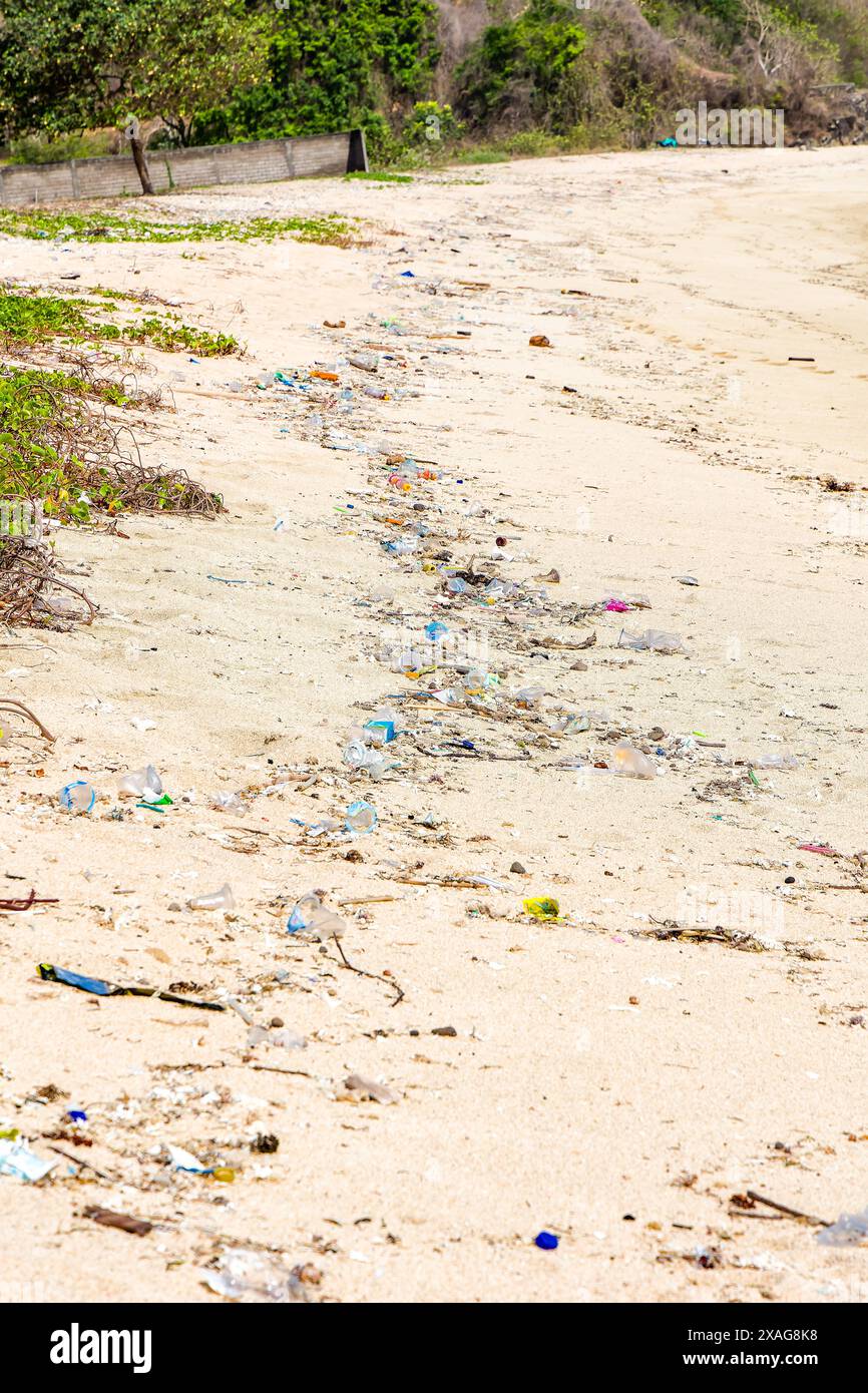 Trash and plastic on the high tide line of a tropical beach in ...