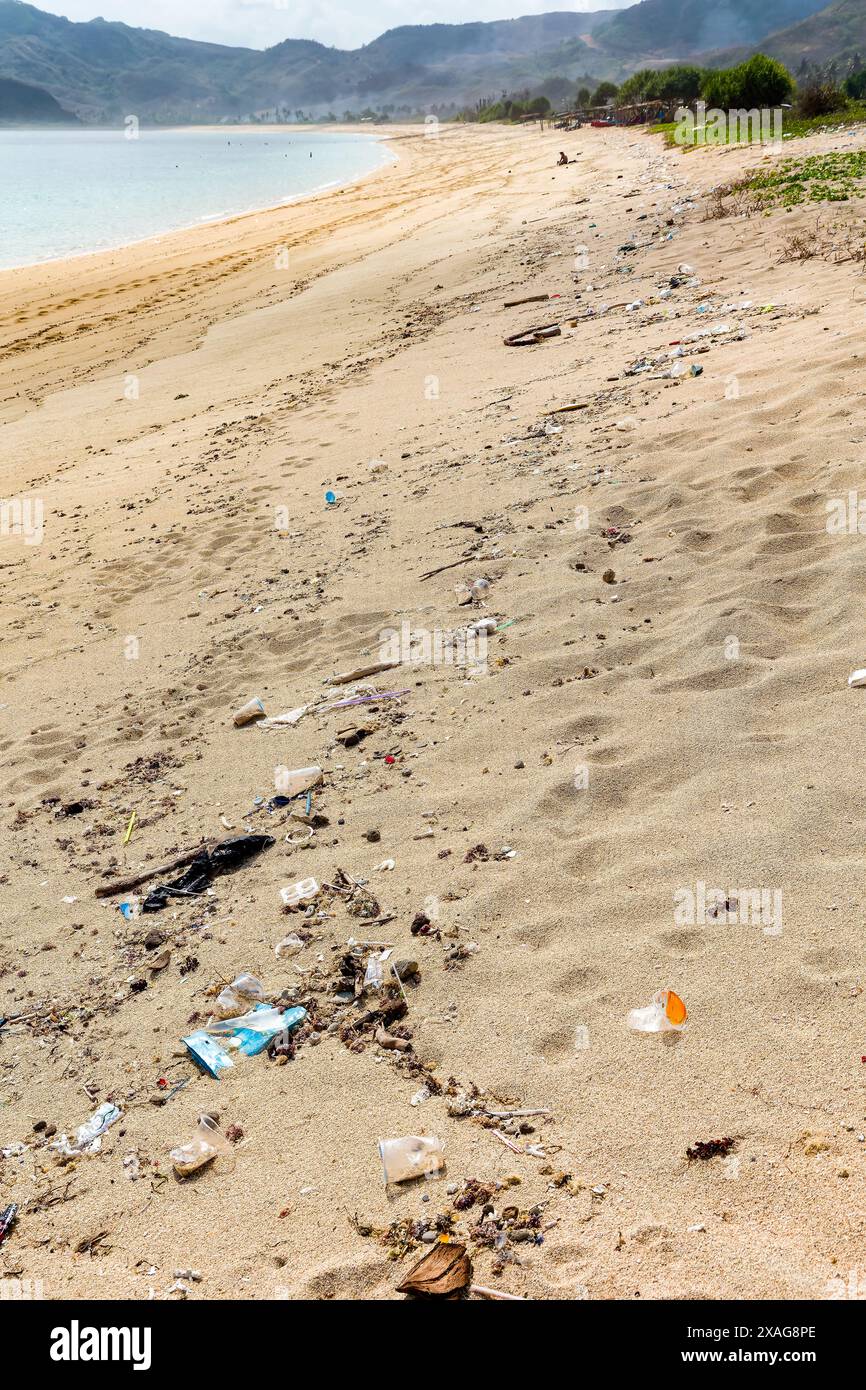 Plastic bottles and other trash washed up on a tropical beach in Lombok ...