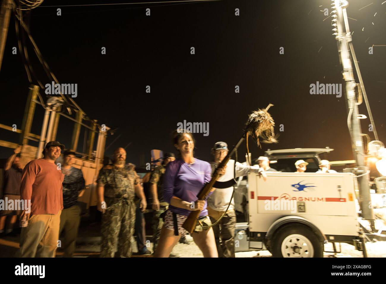 Armed nutria hunters proudly display their rifles at the annual Nutria ...