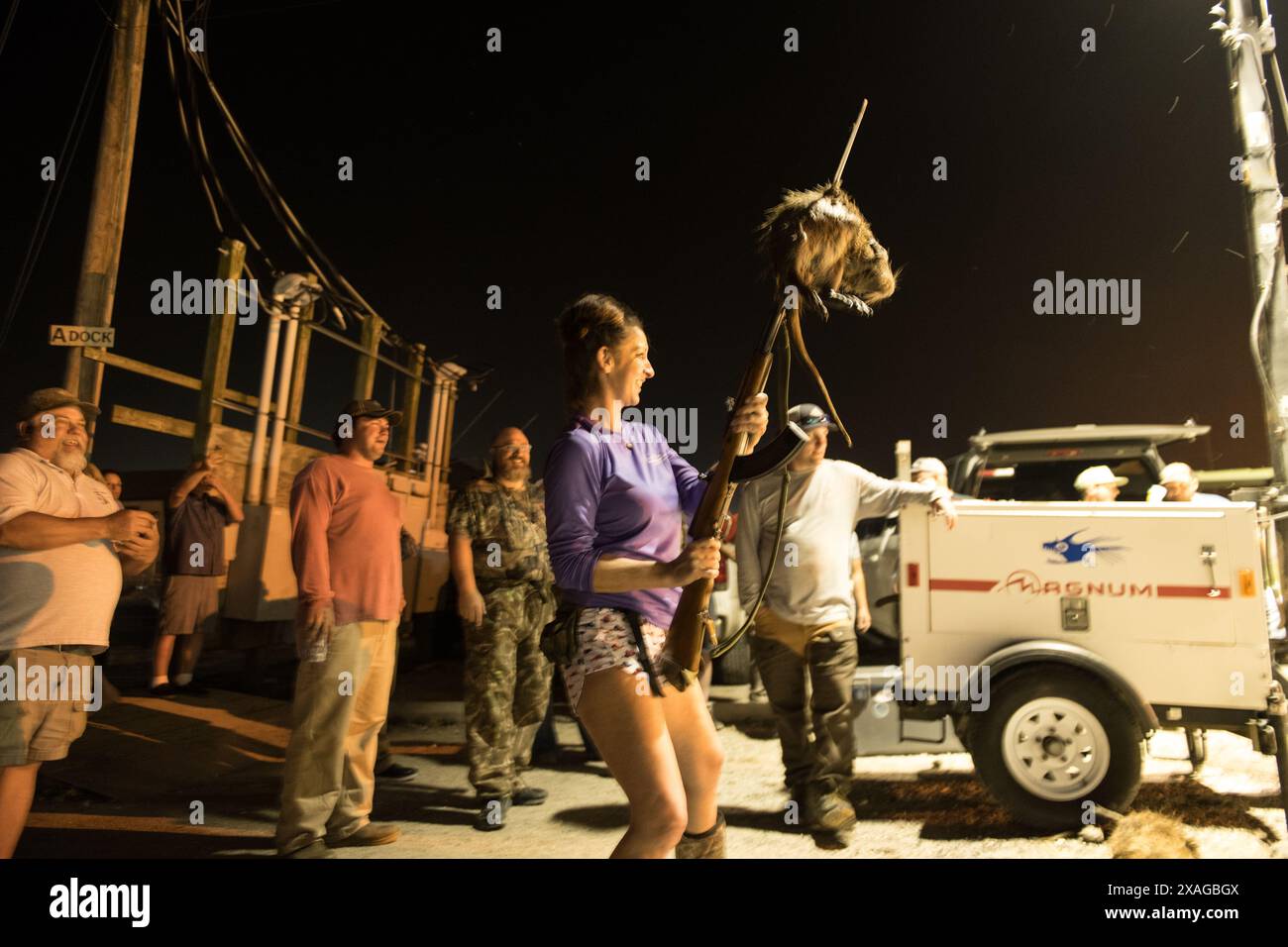Armed nutria hunters proudly display their rifles at the annual Nutria ...