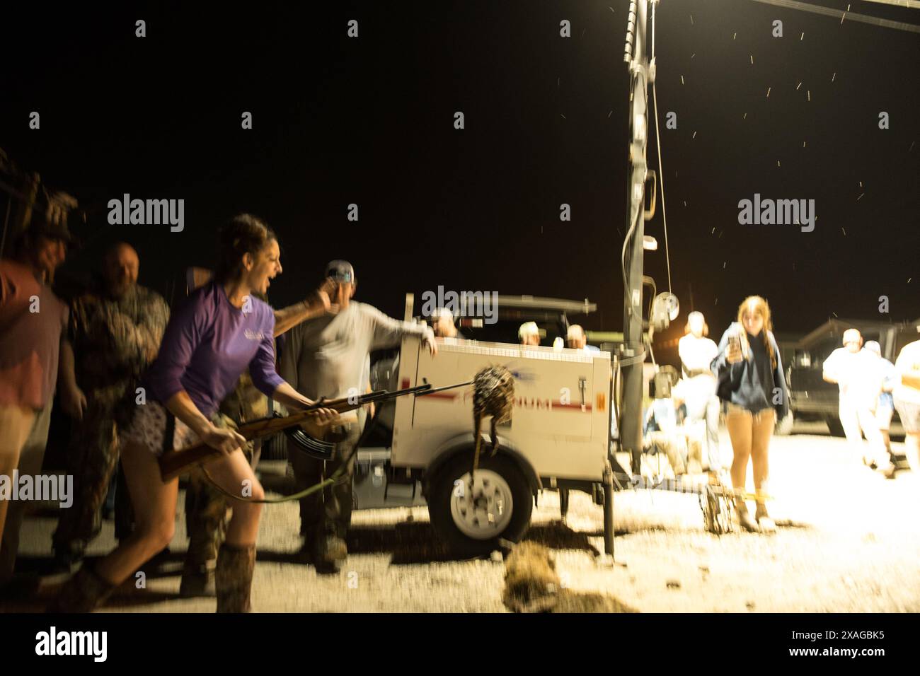 Armed nutria hunters proudly display their rifles at the annual Nutria ...