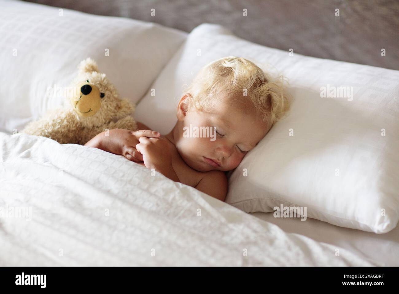 Baby sleeping in white bed. Healthy kids sleep. Little boy napping in ...
