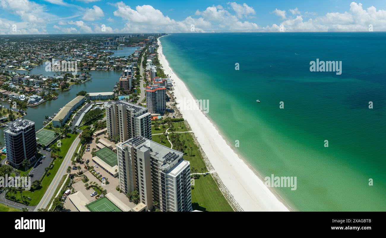 White sand beaches stretch along the Gulf of Mexico in Naples, Florida ...