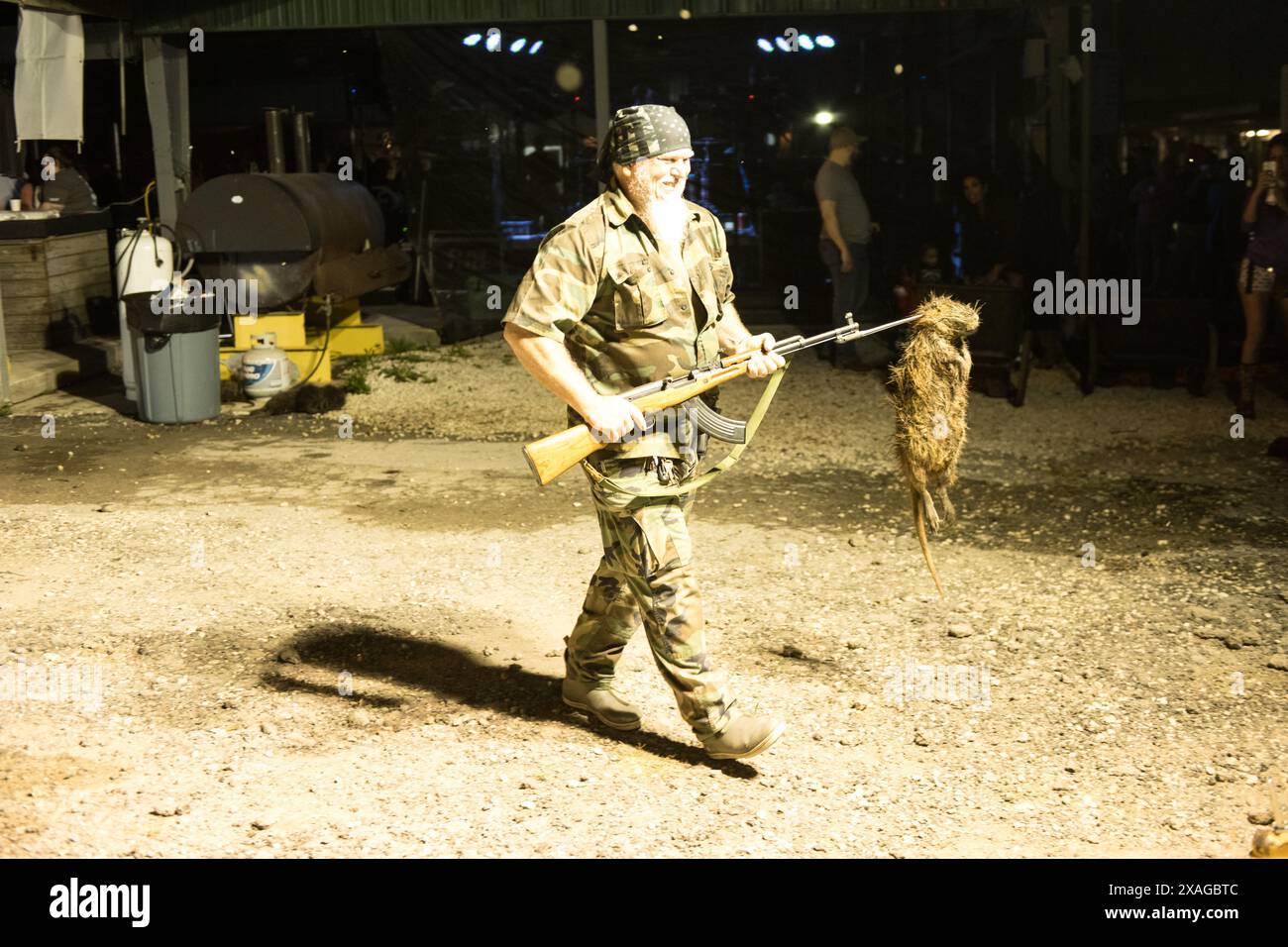 Armed nutria hunters proudly display their rifles at the annual Nutria ...