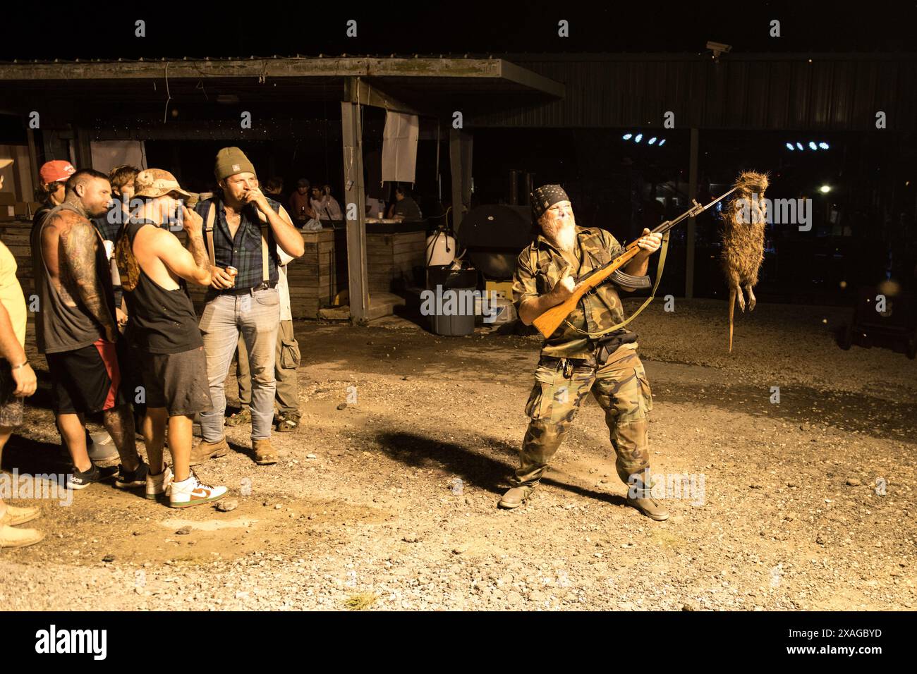 Armed nutria hunters proudly display their rifles at the annual Nutria ...
