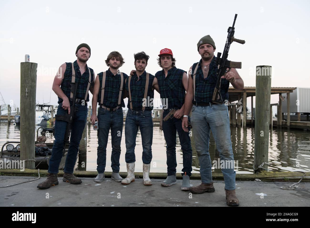 Armed nutria hunters proudly display their rifles at the annual Nutria ...