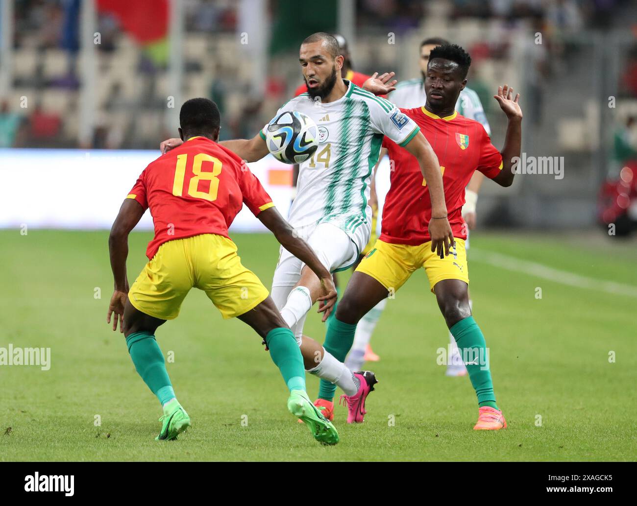 Algiers. 7th June, 2024. Algeria's Nabil Bentaleb (C) controls the ball ...