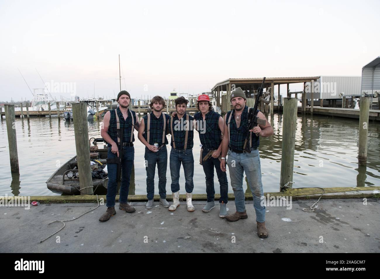 Armed nutria hunters proudly display their rifles at the annual Nutria ...