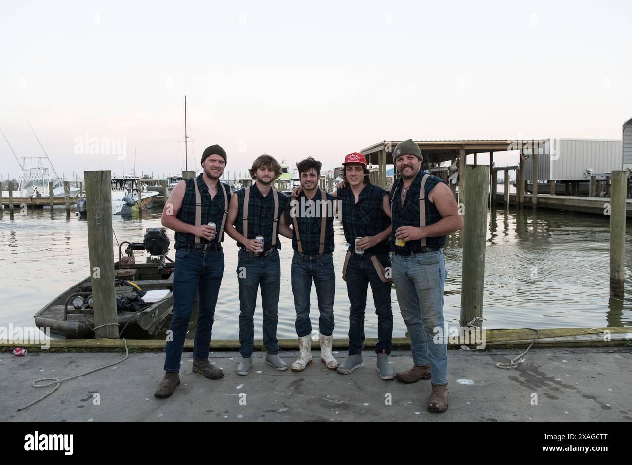 Armed nutria hunters proudly display their rifles at the annual Nutria ...