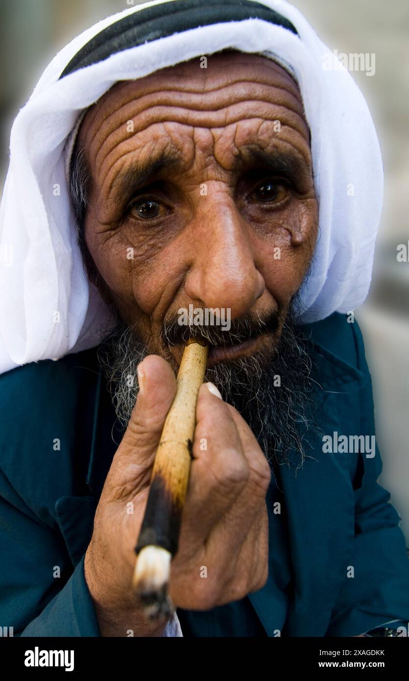 An elderly Palestinian man smoking his cigarette in the Muslim quarter ...