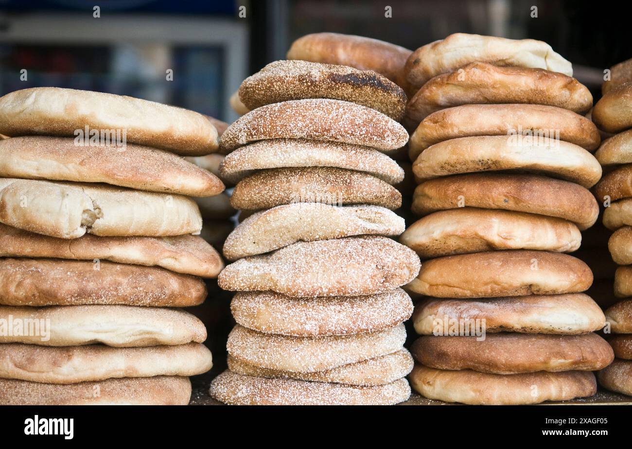 Traditional Moroccan Pita bread displayed at a bakery in the old city in Marrakesh, Morocco ...
