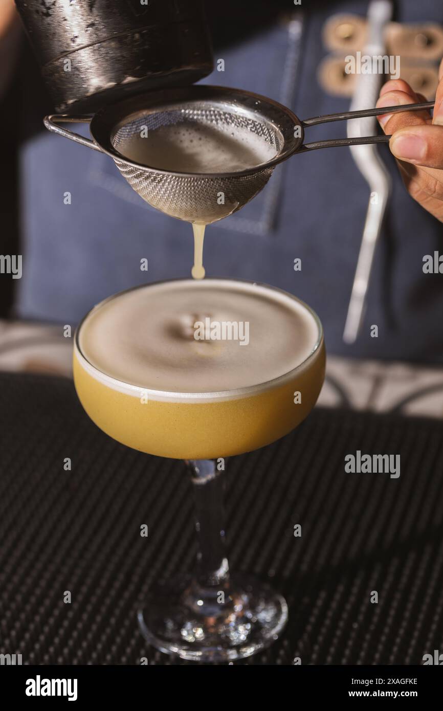 Drinks in a bar and barman Stock Photo - Alamy