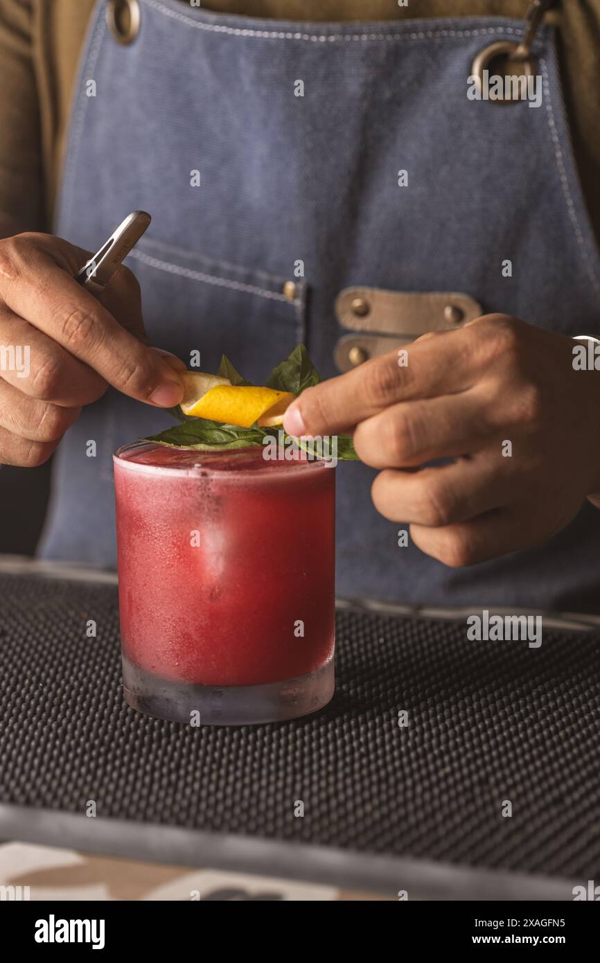 Drinks in a bar and barman Stock Photo - Alamy