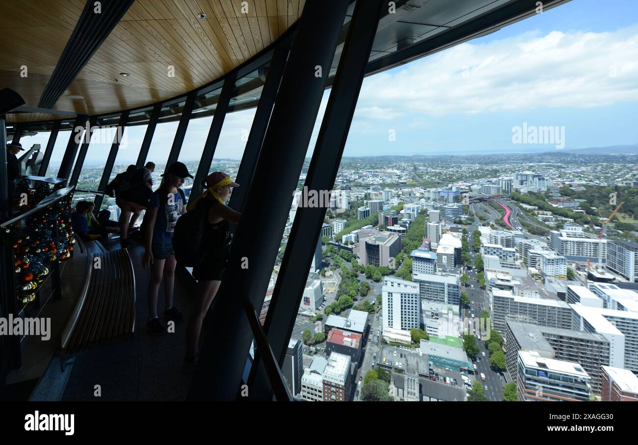 Tourist enjoying the city views from the observation deck at the Sky ...