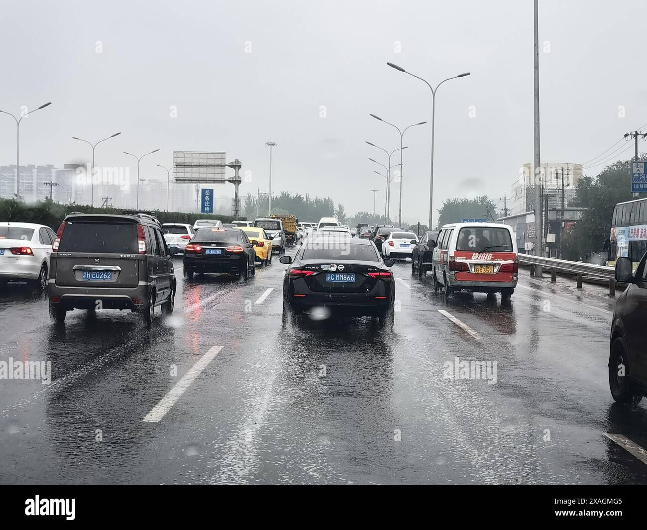 BEIJING, CHINA - JUNE 7, 2024 - Vehicles jam in the rain on the West ...
