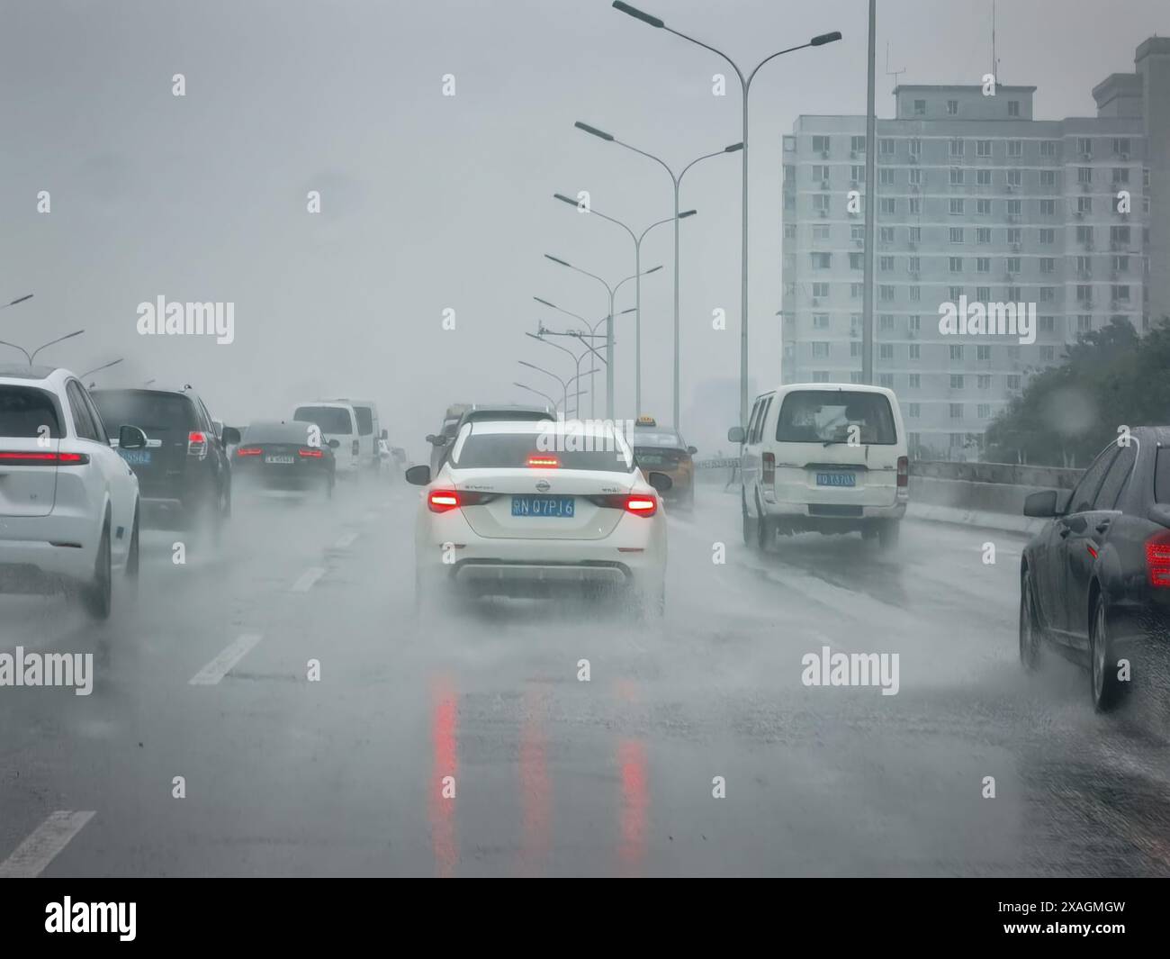 BEIJING, CHINA - JUNE 7, 2024 - Vehicles jam in the rain on the West ...