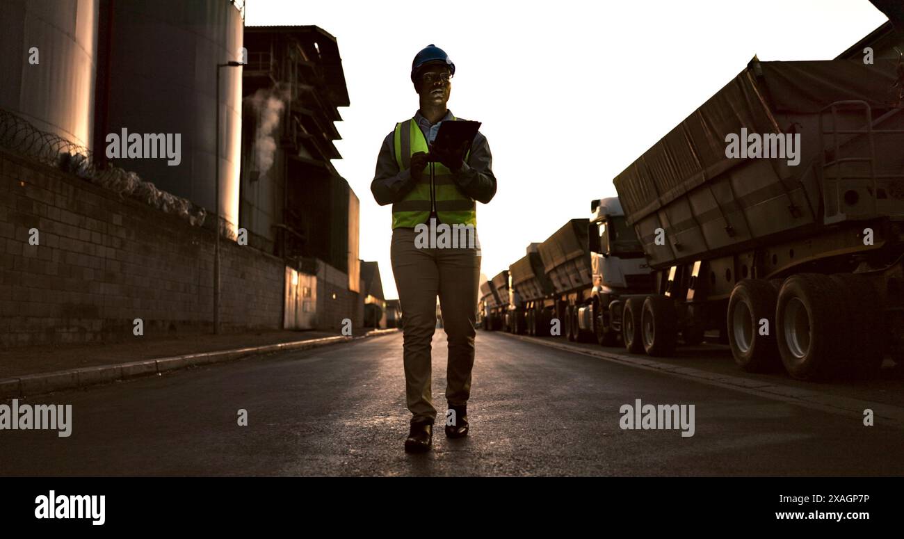 Construction worker, man or walking with tablet on site in morning for ...