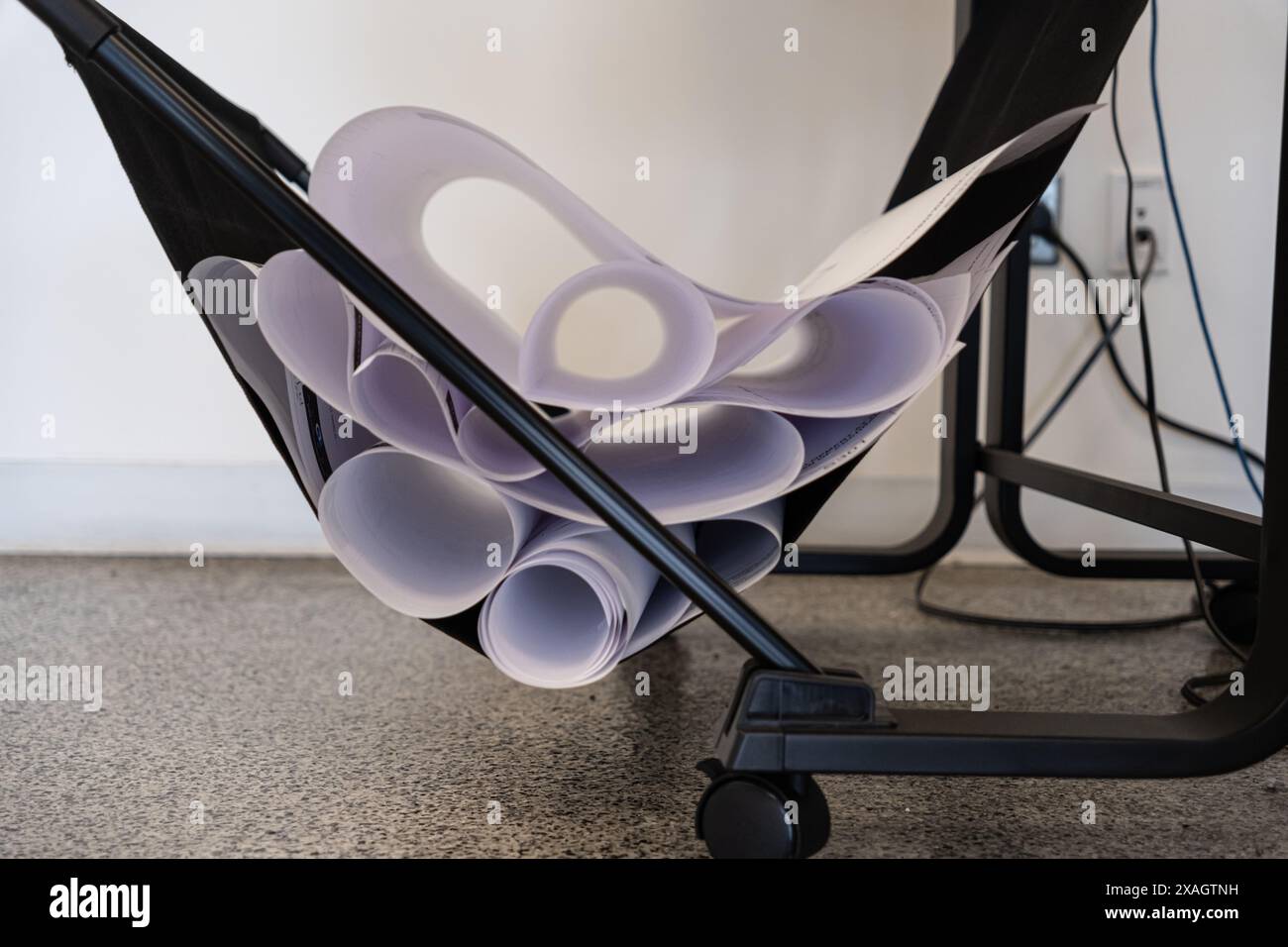 Printed blueprints in plotter printer basket Stock Photo - Alamy