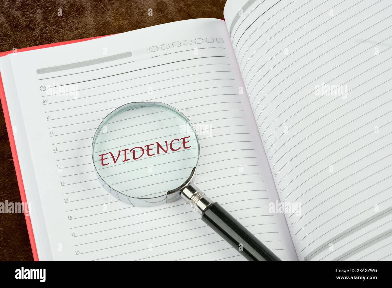 Word Evidence written through a magnifying glass in the notebook of a ...