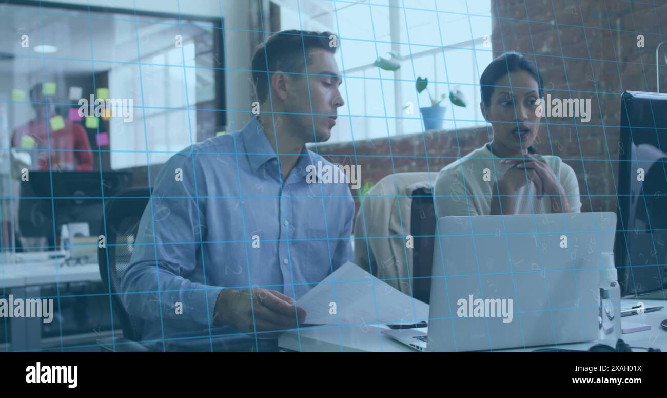 A diverse group of colleagues working together on project, with a ...