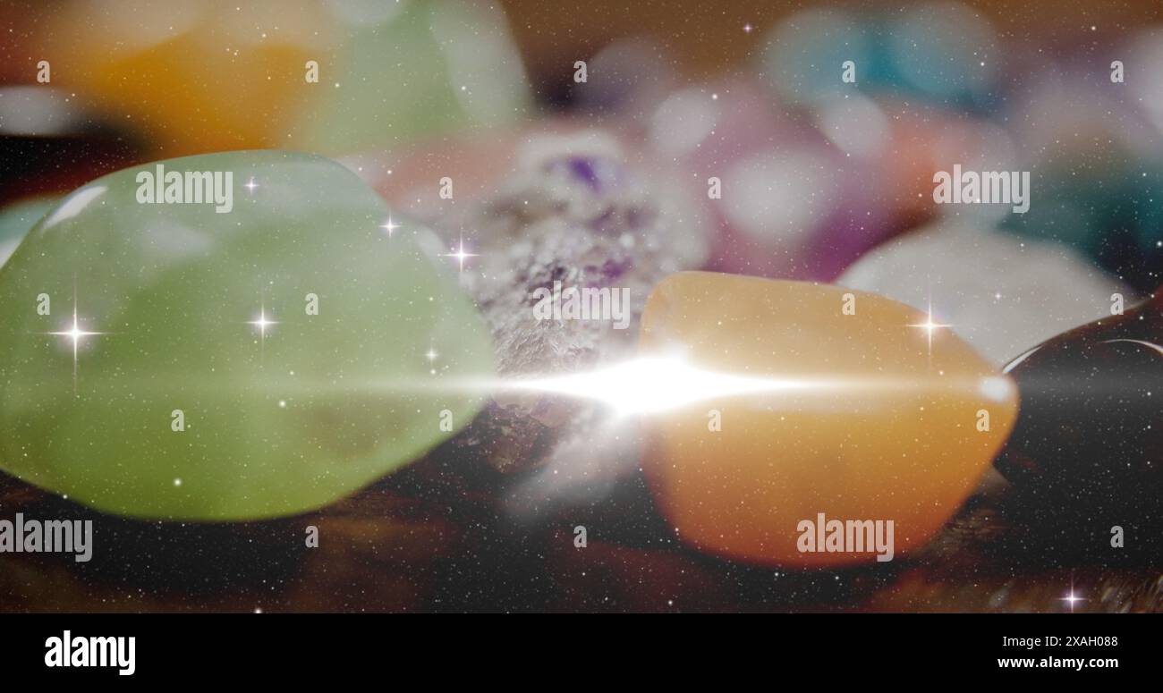 Image of stars and light spots over colourful stones, copy space Stock ...