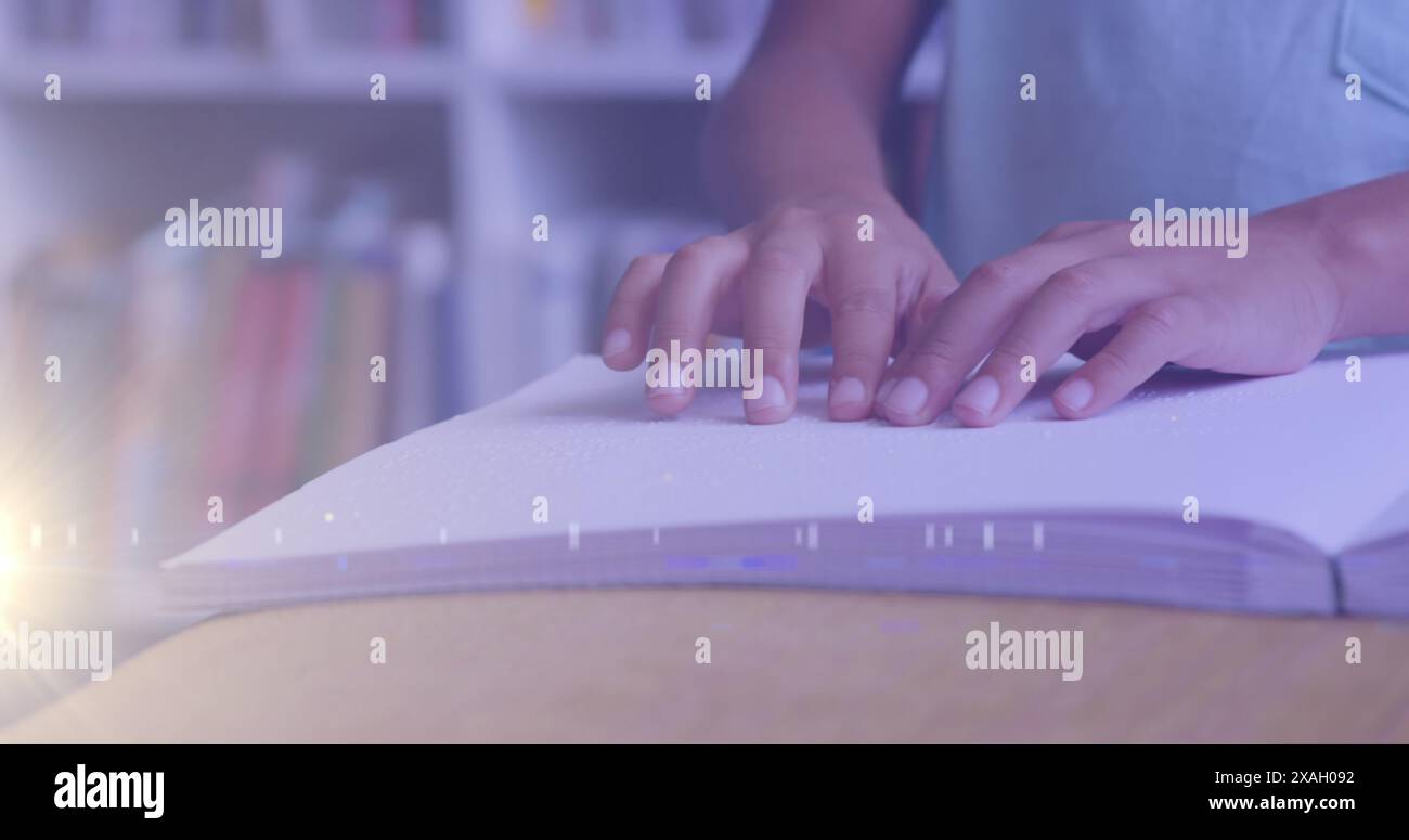 Image of light trails over biracial boy reading braille Stock Photo - Alamy