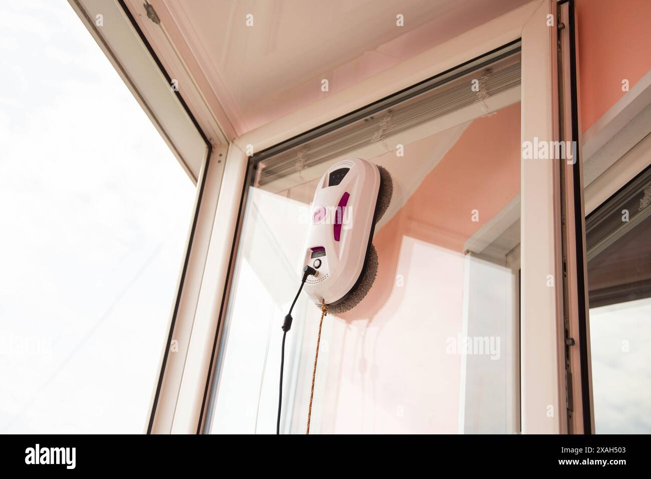 Automatic vacuum robot window washer washes glass from dirt. Modern ...